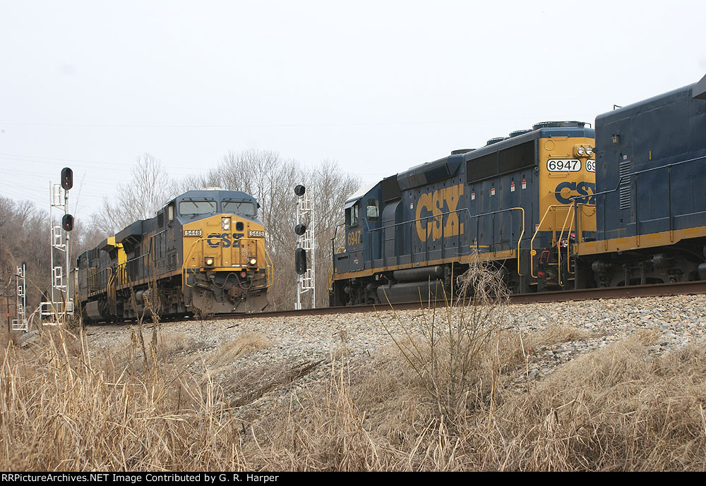372 - 5448 EB on U18616 meets the H744 local in the siding at Reusens